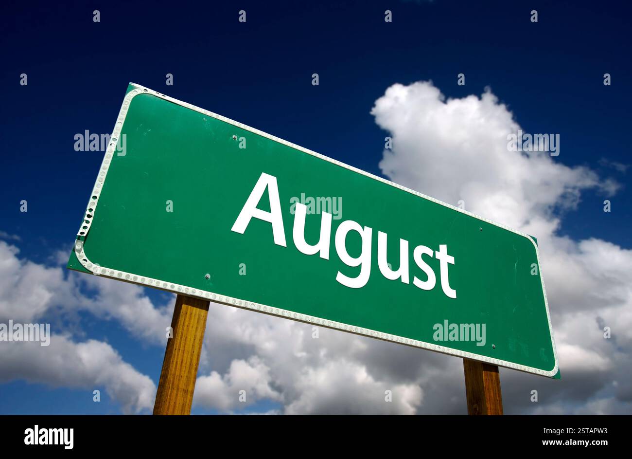 August Green Road Sign with dramatic blue sky and clouds - Months of ...