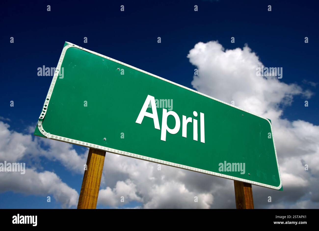 April Green Road Sign with dramatic blue sky and clouds - Months of the ...