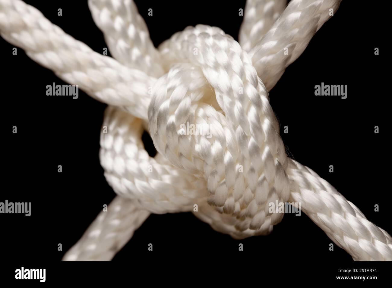 Nylon Rope Knot on a Black Background Stock Photo - Alamy
