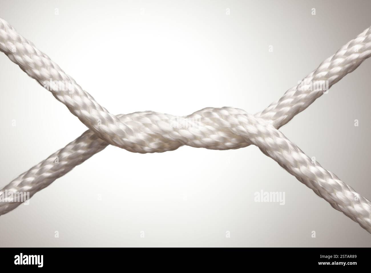 Nylon Rope Knot on a Spot Lit Background Stock Photo - Alamy