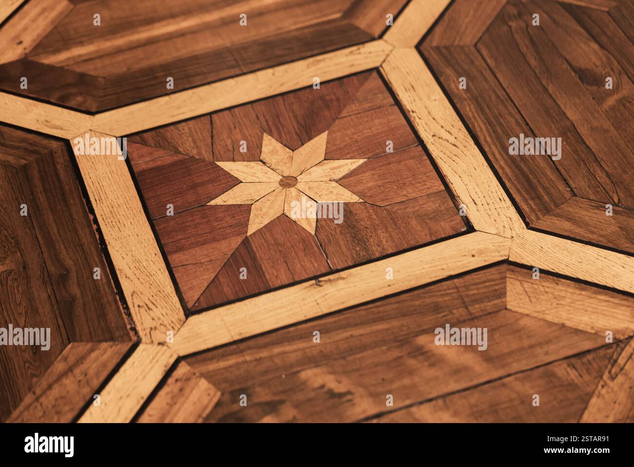 Detailed view of a beautiful parquet floor with a geometric star ...