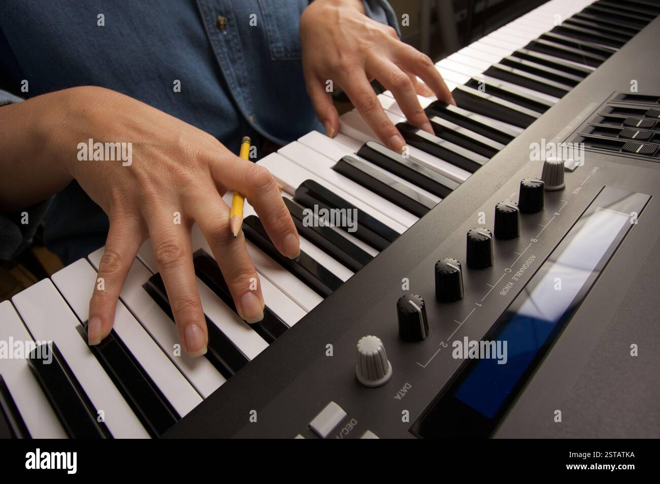 Woman's Fingers on Digital Piano Keys Stock Photo - Alamy