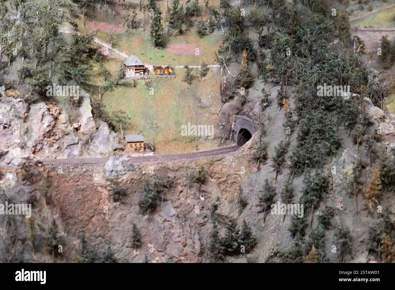 Model railway with tunnel. A miniature scale model railway with a ...