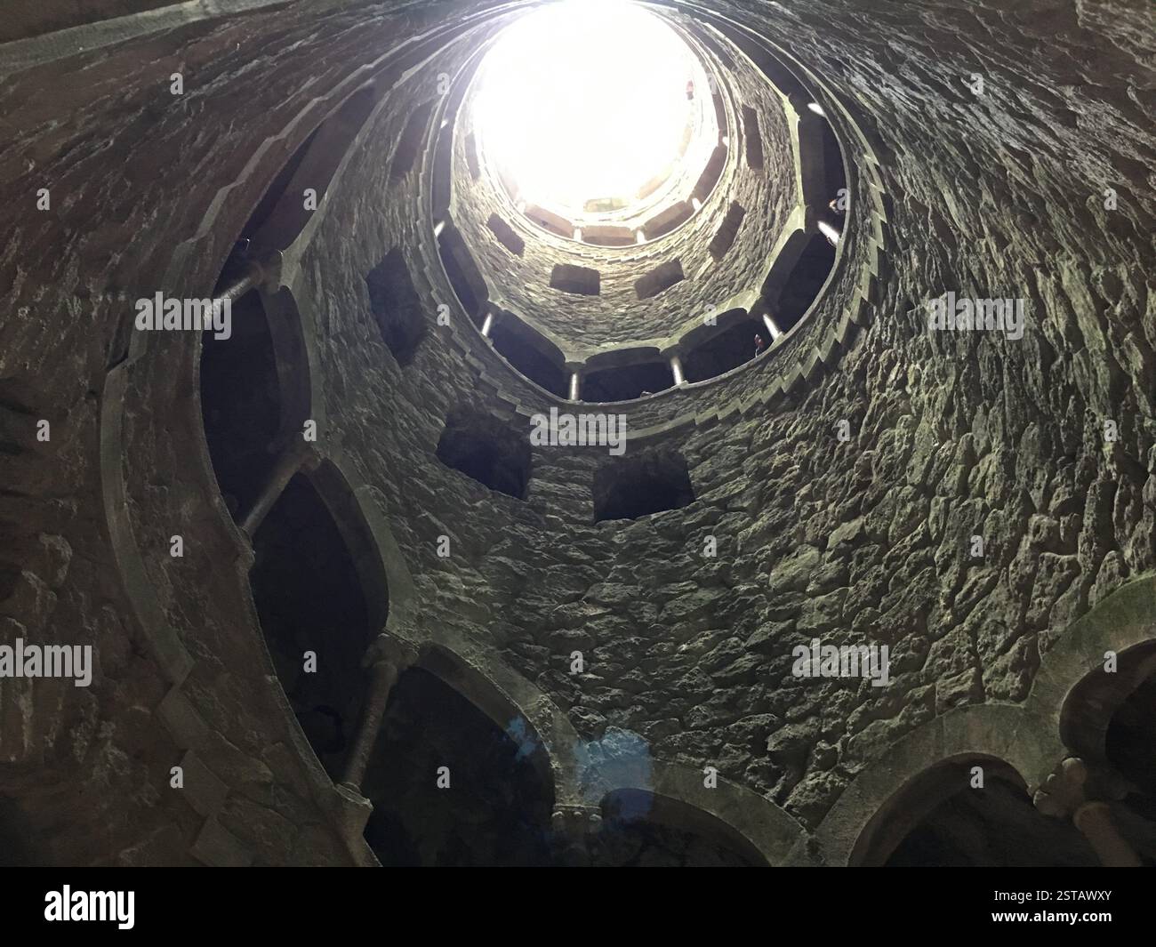 Regaleira Tower, Sintra, Portugal. A spiral staircase leads to a ...