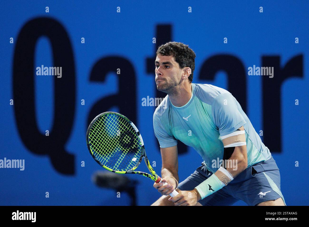 Aziz Dougaz of Tunisia during the 2025 Qatar ExxonMobil Open, ATP 500 ...