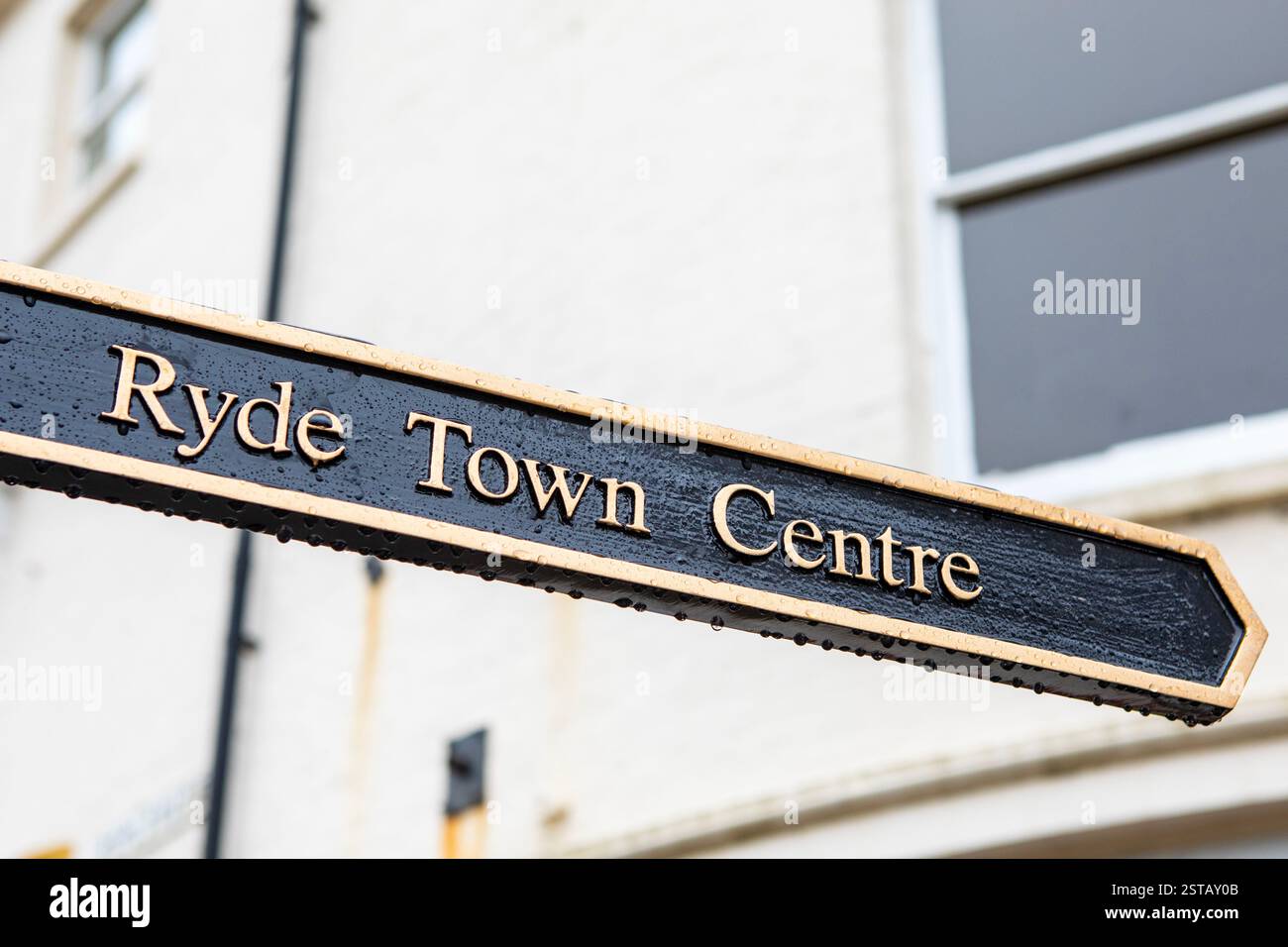 Close-up of a signpost pointing towards the town centre in Ryde, on the ...