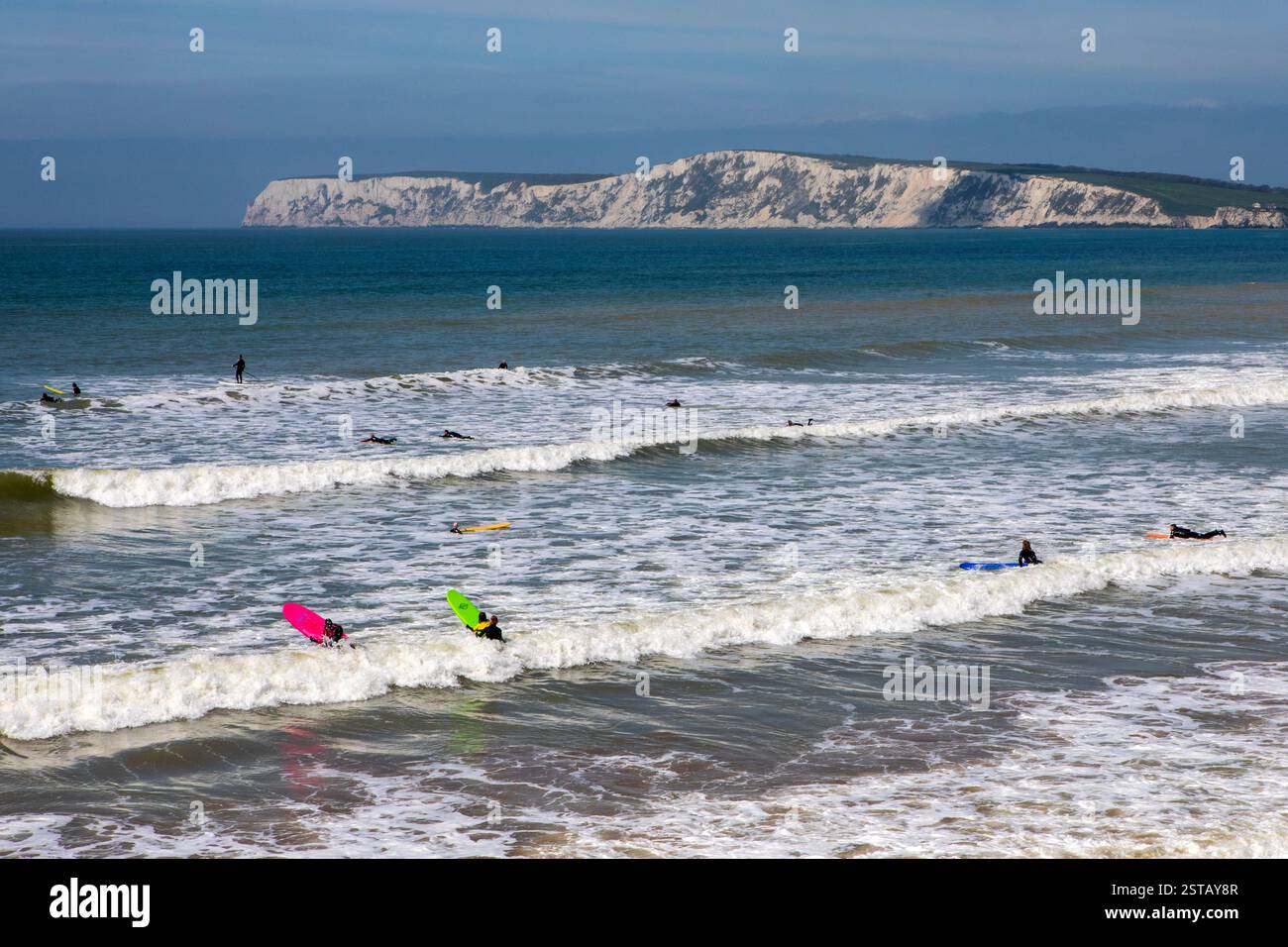 Isle of Wight, UK - May 7th 2023:Surfers riding the waves at Compton ...