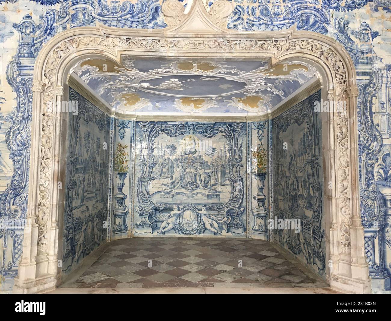 Azulejo-tiled alcove. Intricate blue and white patterns depict scenes ...