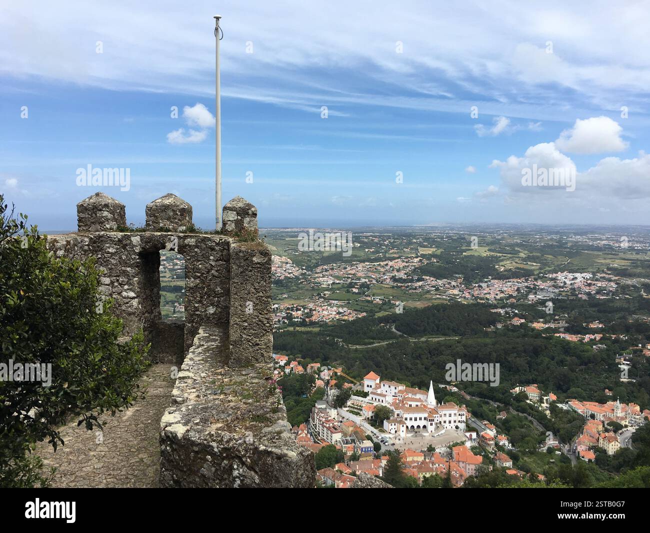 The photo shows a castle wall overlooking a vast landscape. Picturesque ...