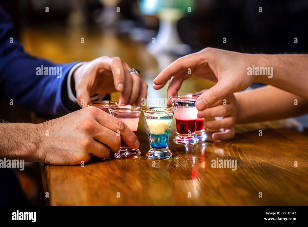 Several alcohol shot glasses.Shots on a bar counter top. Set of shot ...