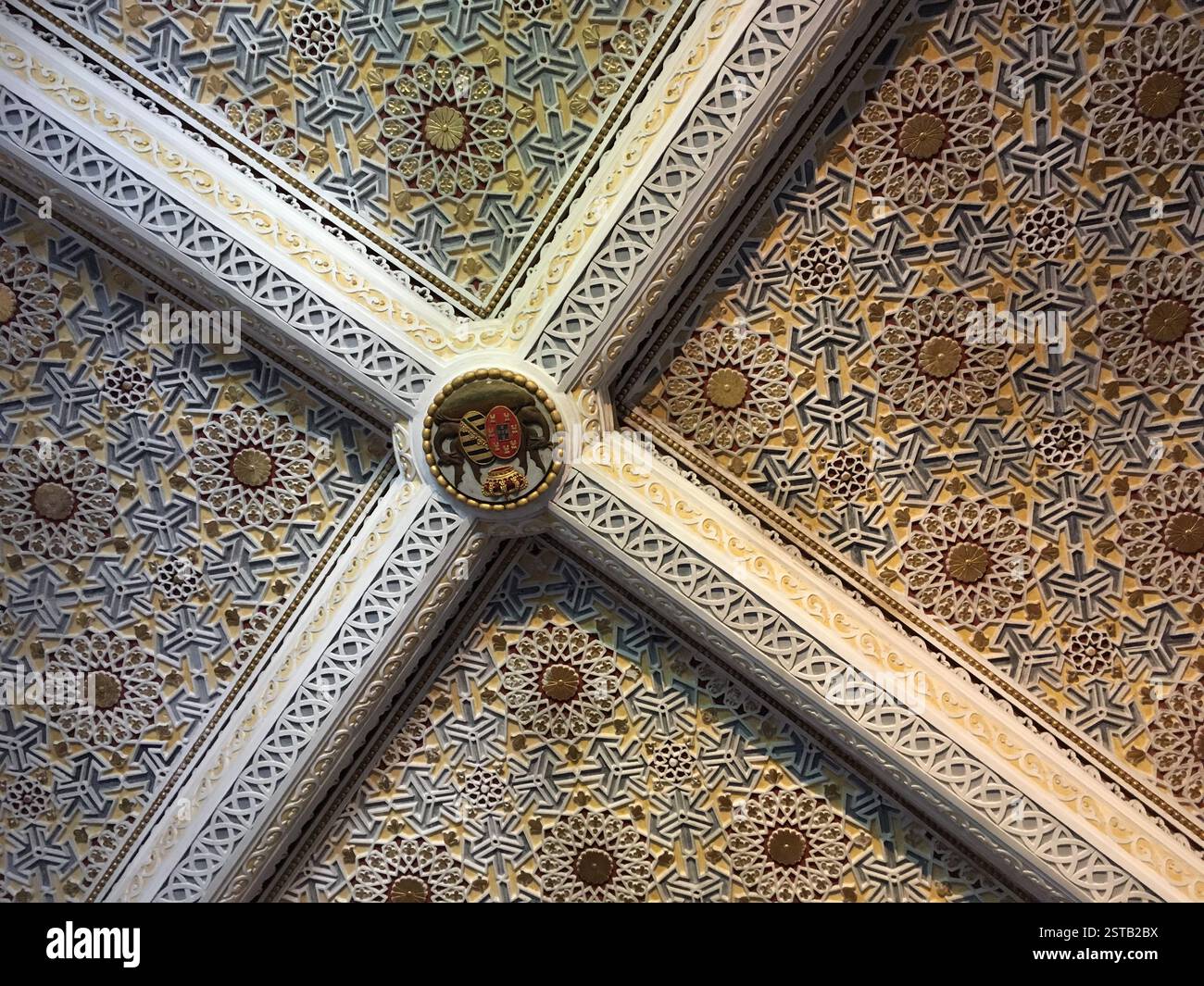 Ceiling, ornate geometric patterns in blue, yellow, and white. Central ...
