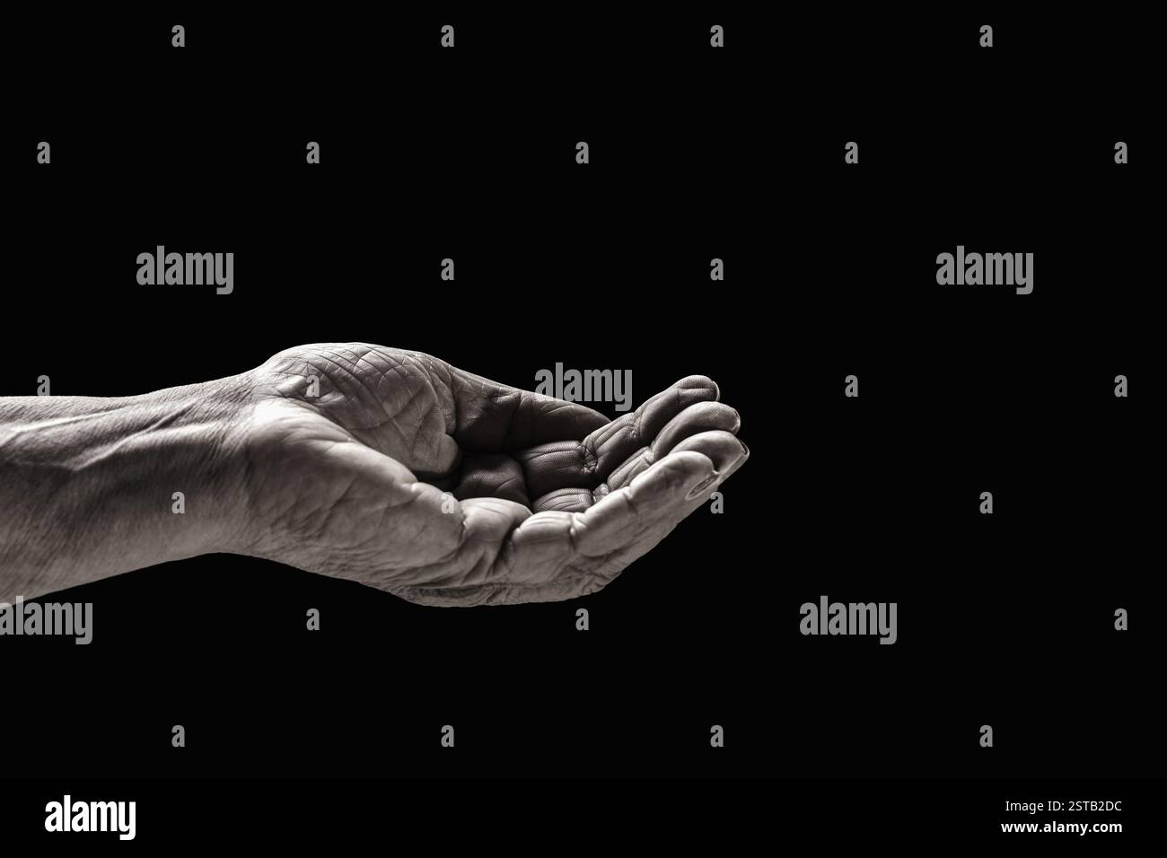 Old man hand on a black background. Old lady's hand with open palm ...