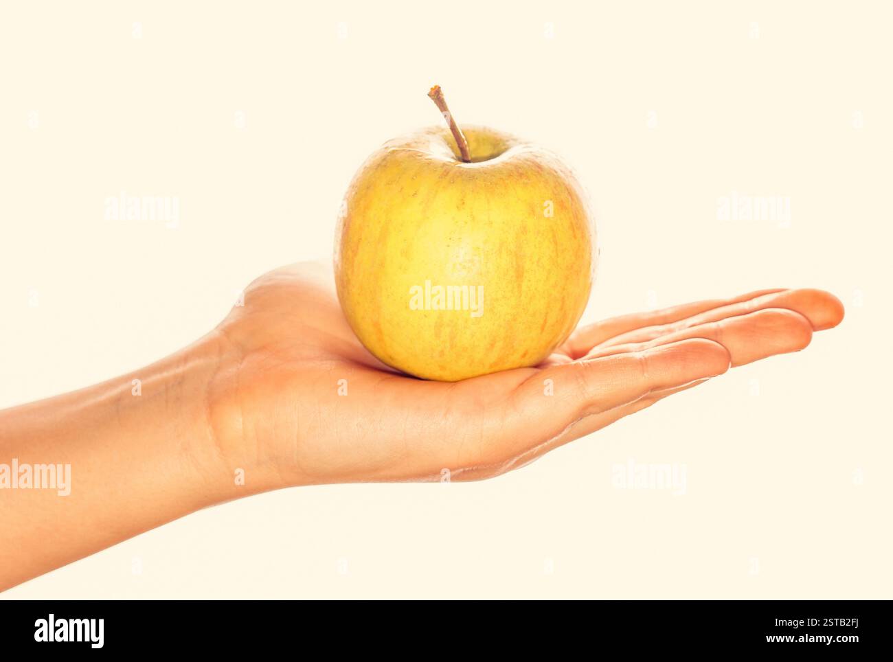Man's hand holding green apple, isolated on white background. Hand ...