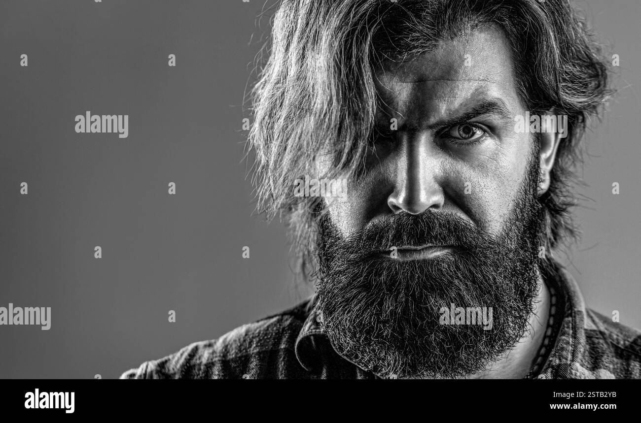 Man portrait isolated. Man hairdresser in a plaid shirt, barbershop ...