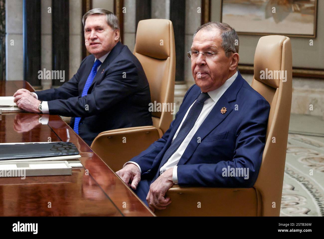 Russian Foreign Minister Sergei Lavrov, right, sits next to Russian ...