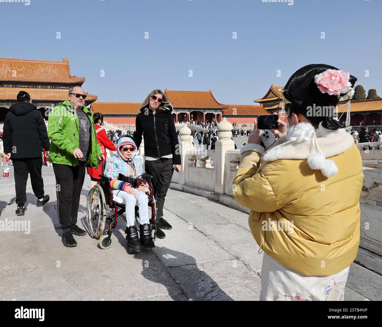 Foreign tourists visit the Palace Museum in Beijing, China, 15 February ...