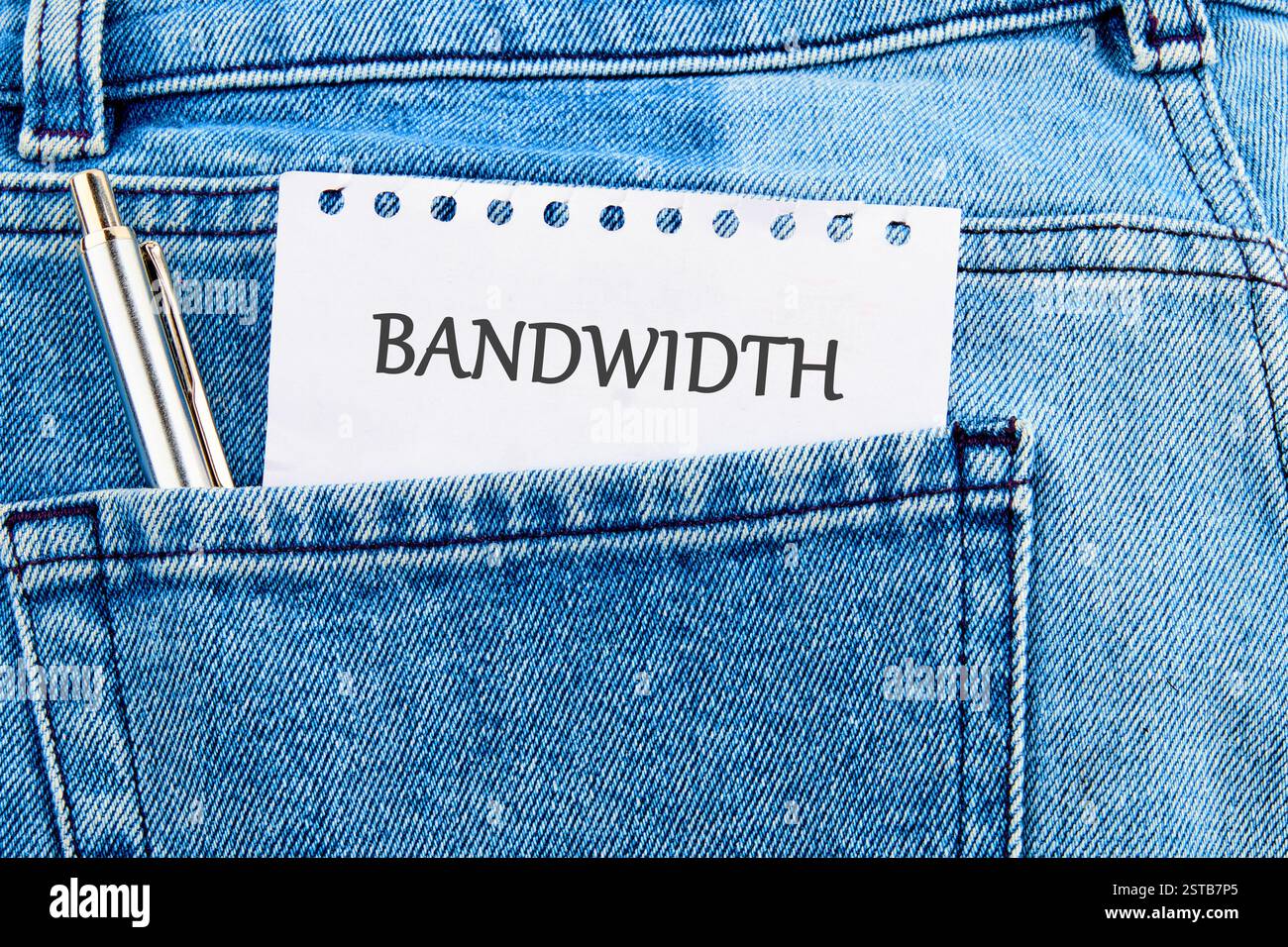 A notepad labeled bandwidth peeks from a jeans pocket, underscoring the ...