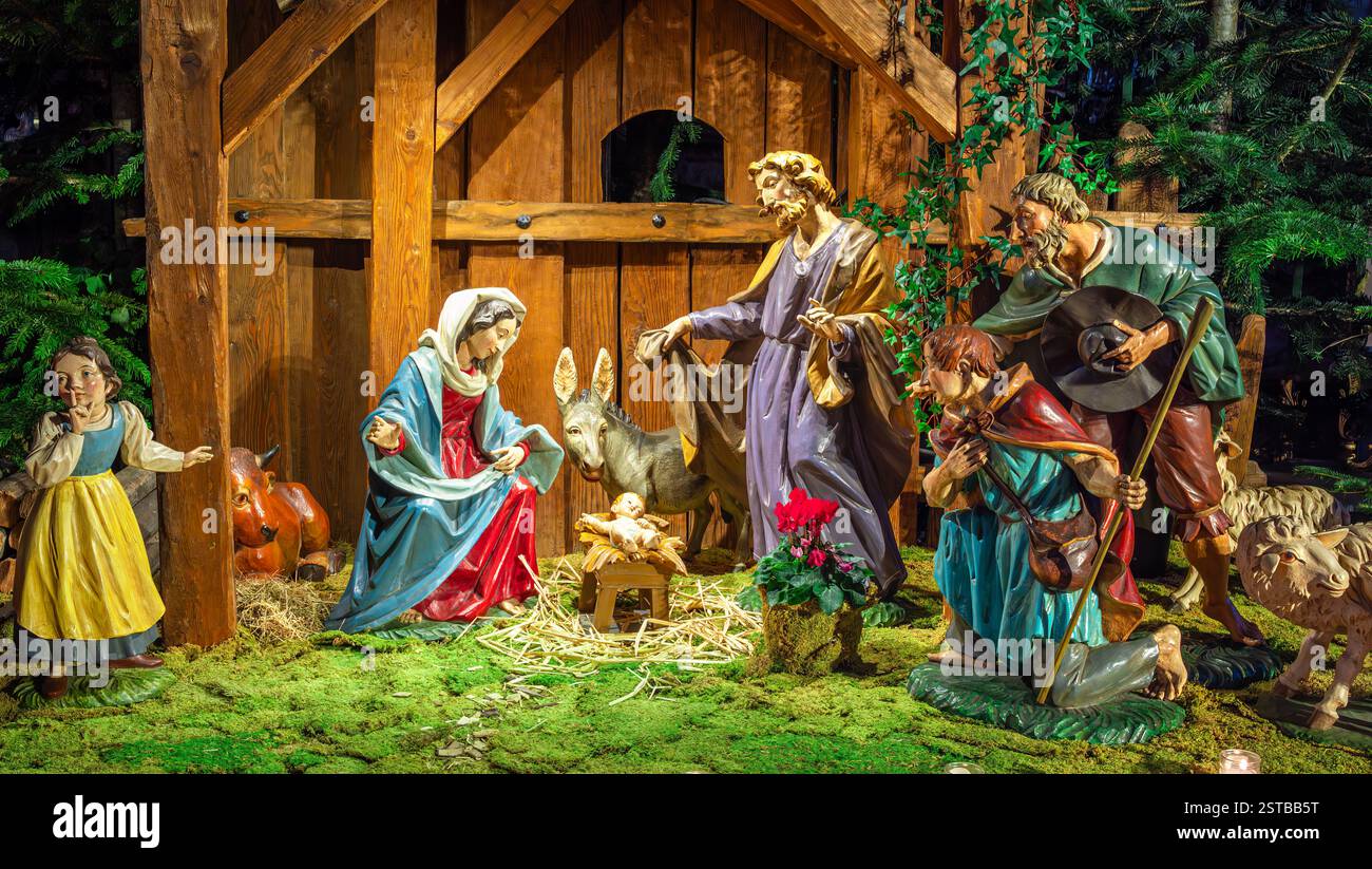 A traditional nativity scene with figurines depicting the birth of ...