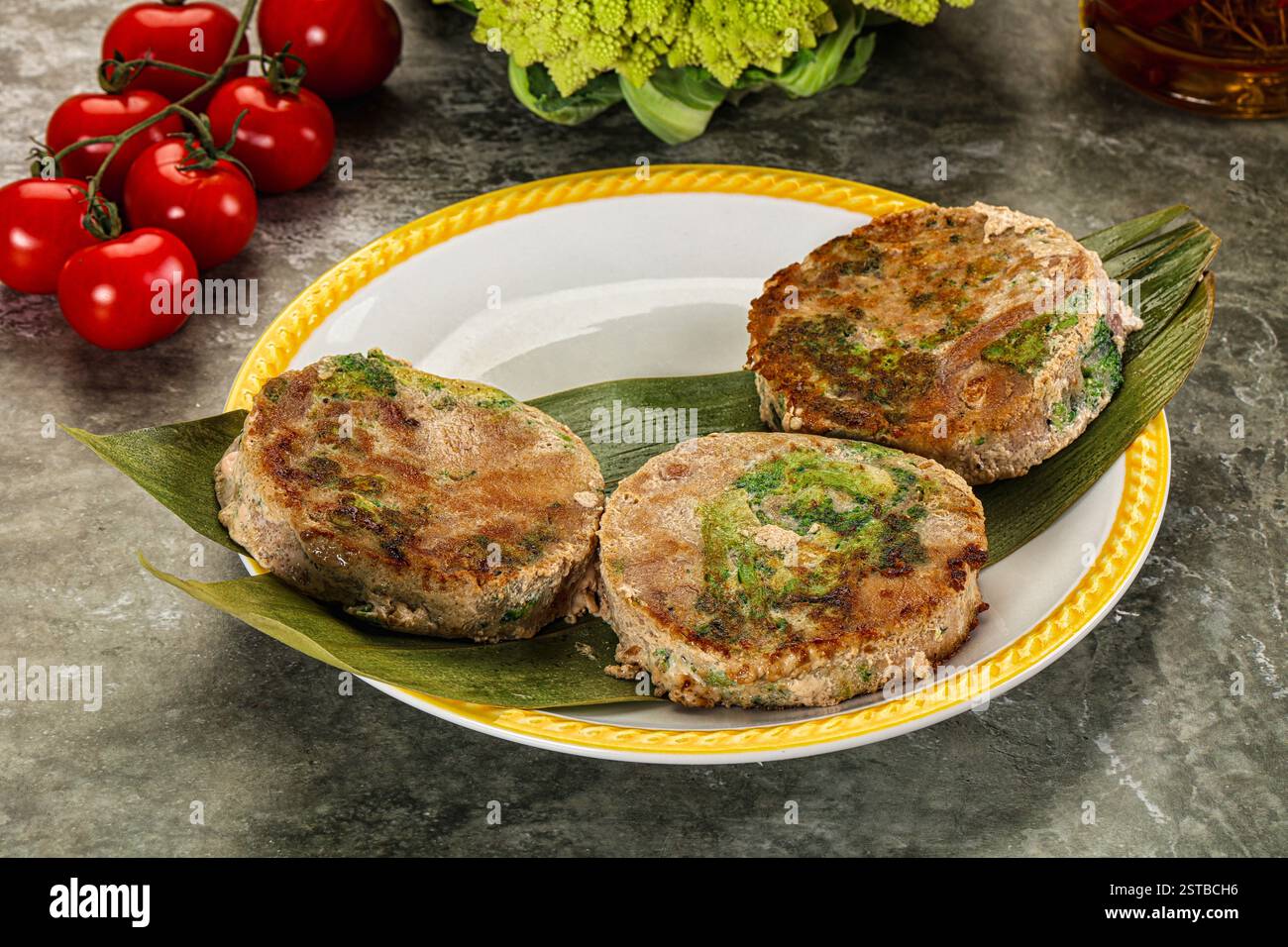 Roasted tuna medallion with broccoli cabbage Stock Photo - Alamy