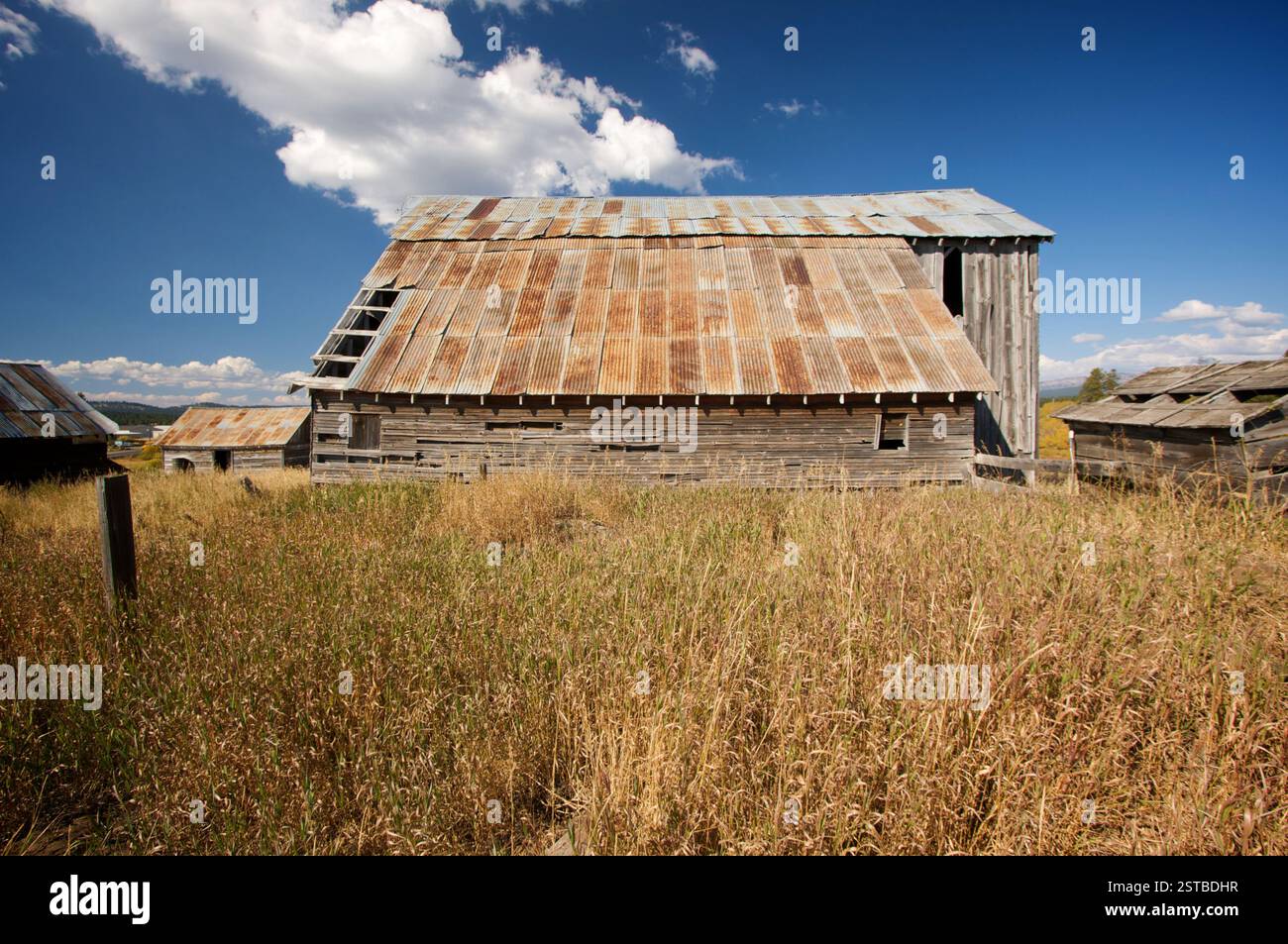 Rustic Barn Scene with Deep Blue Sky and Clouds Stock Photo - Alamy