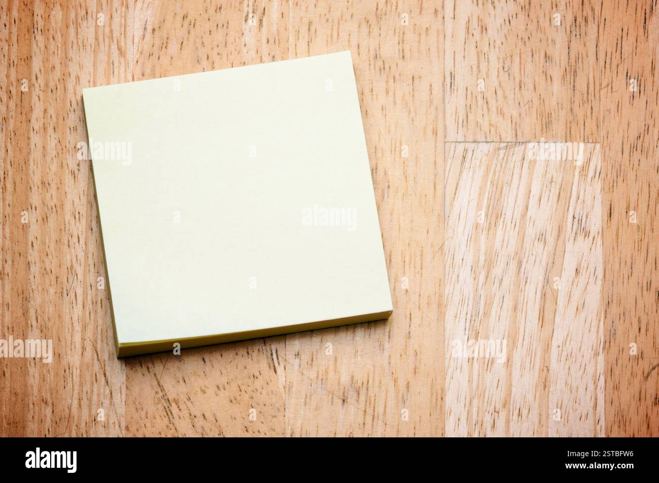 Post It Note Pad on a Wood Background Stock Photo - Alamy