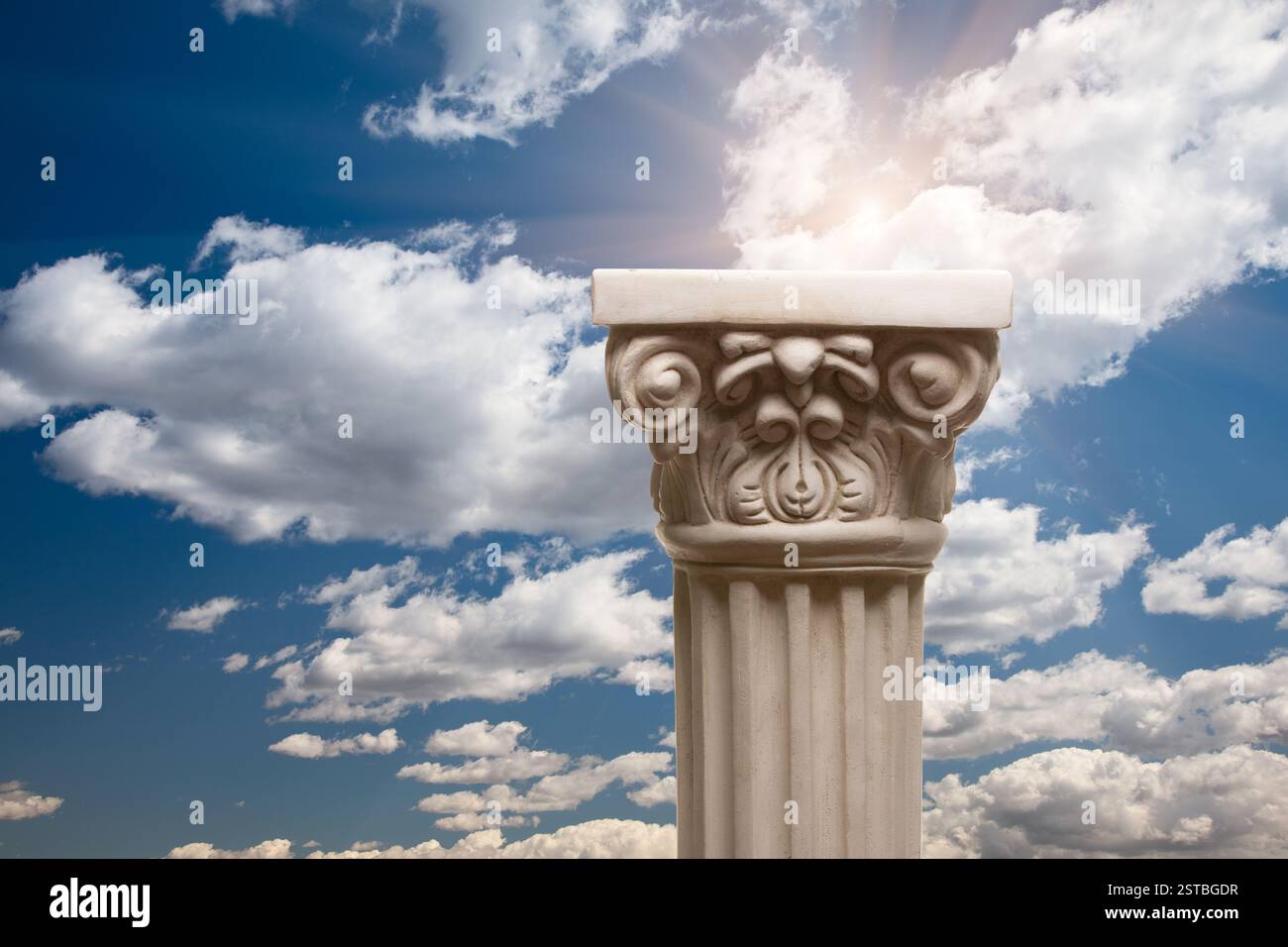 Ancient Replica Column Pillar Over Dramatic Clouds and Sunburst Stock ...