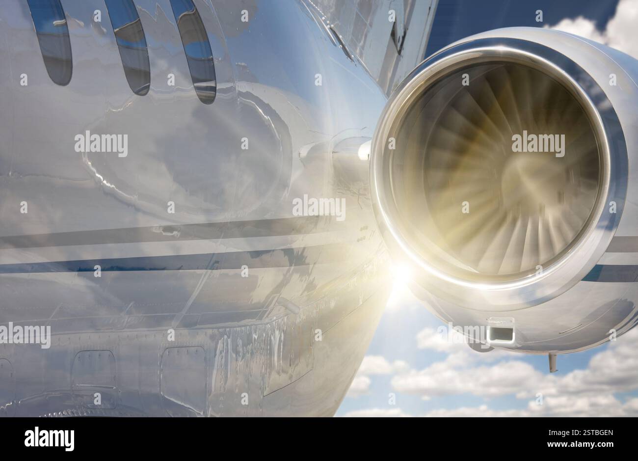 Private Jet and Engine Abstract With Sunburst and Clouds Stock Photo ...