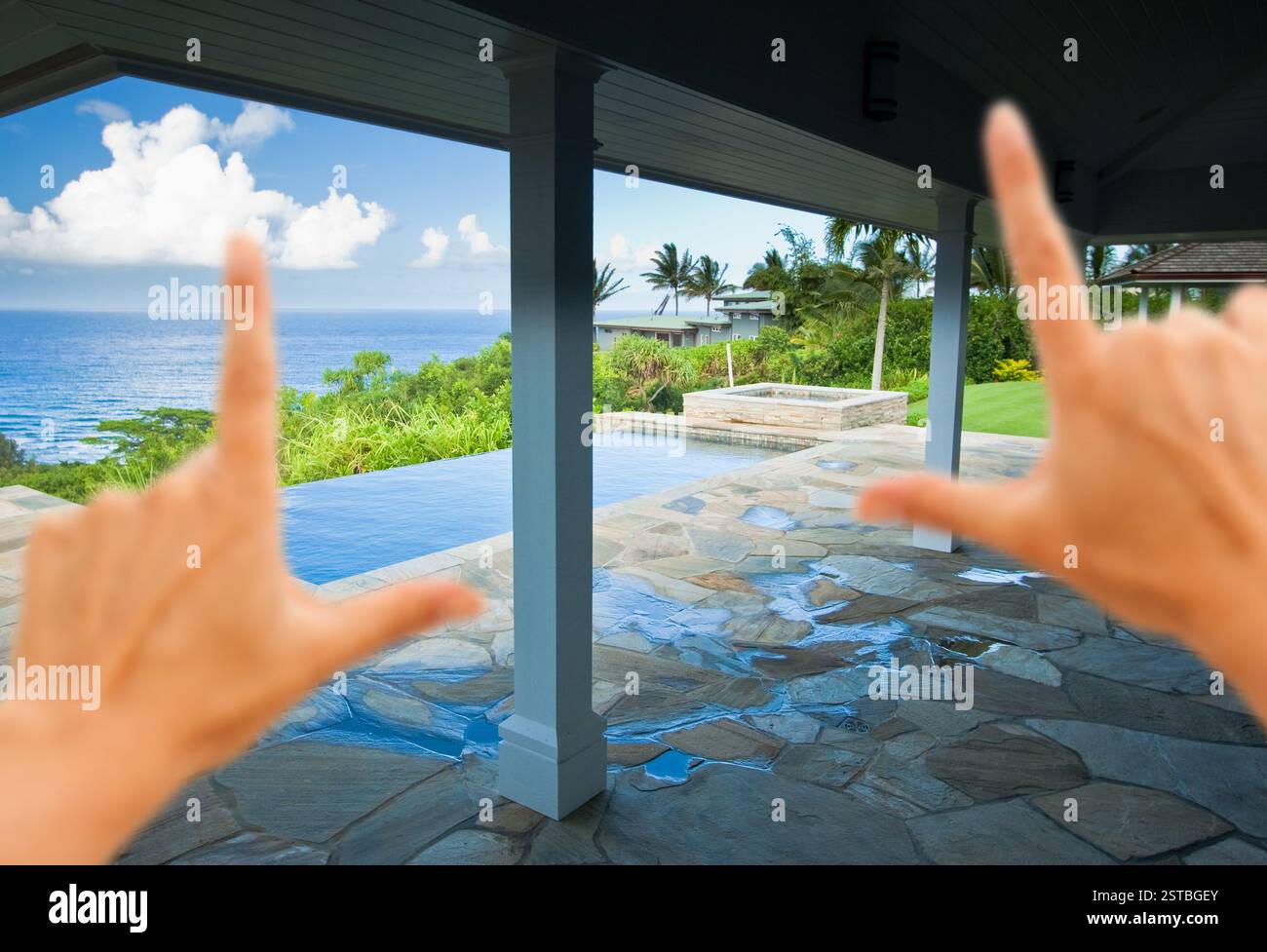 Hands Framing Breathtaking Hawaiian Ocean View Deck and Pool with Deep ...