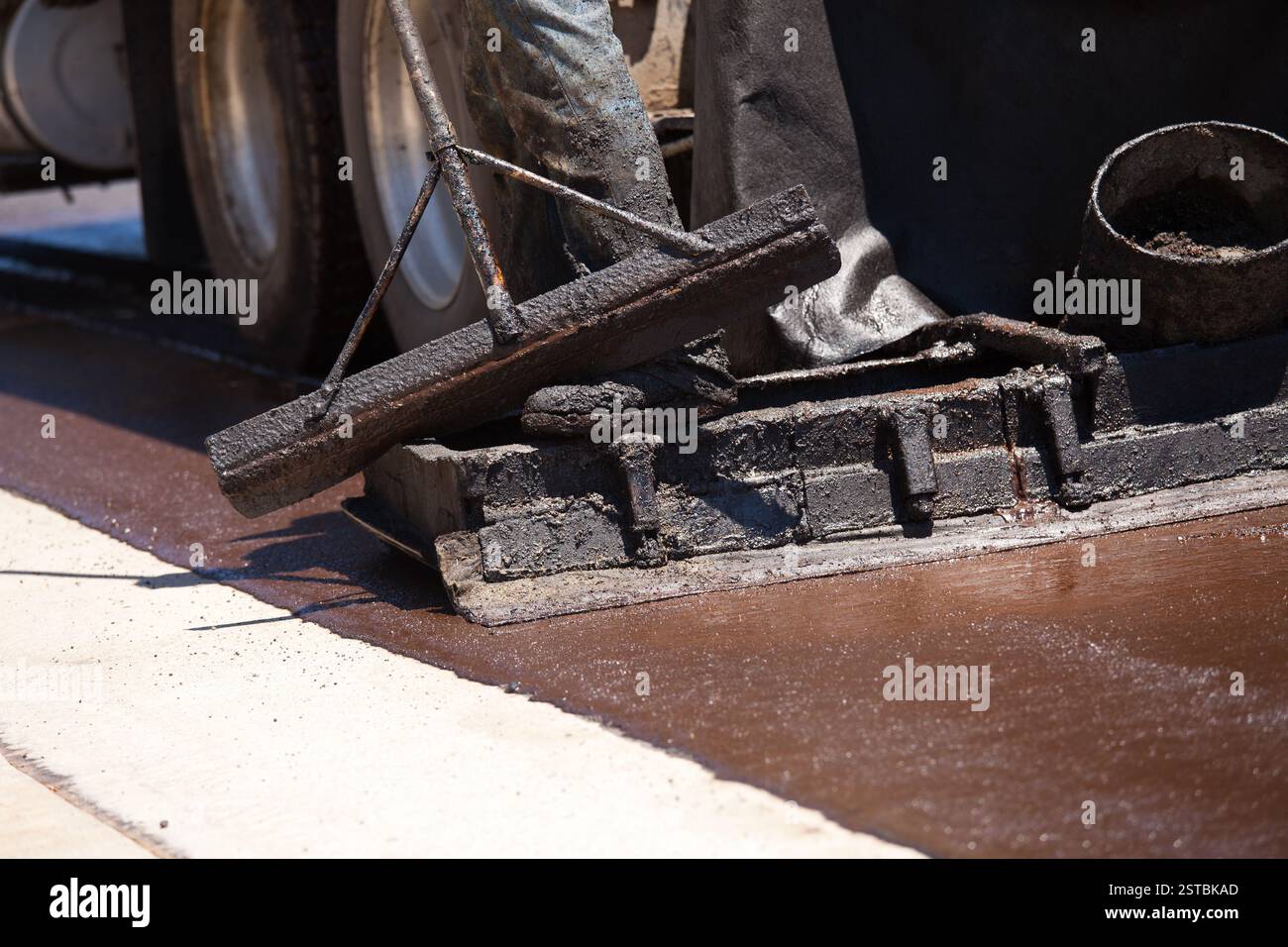 Road Worker Resurfacing Street with Hot Tar Stock Photo - Alamy