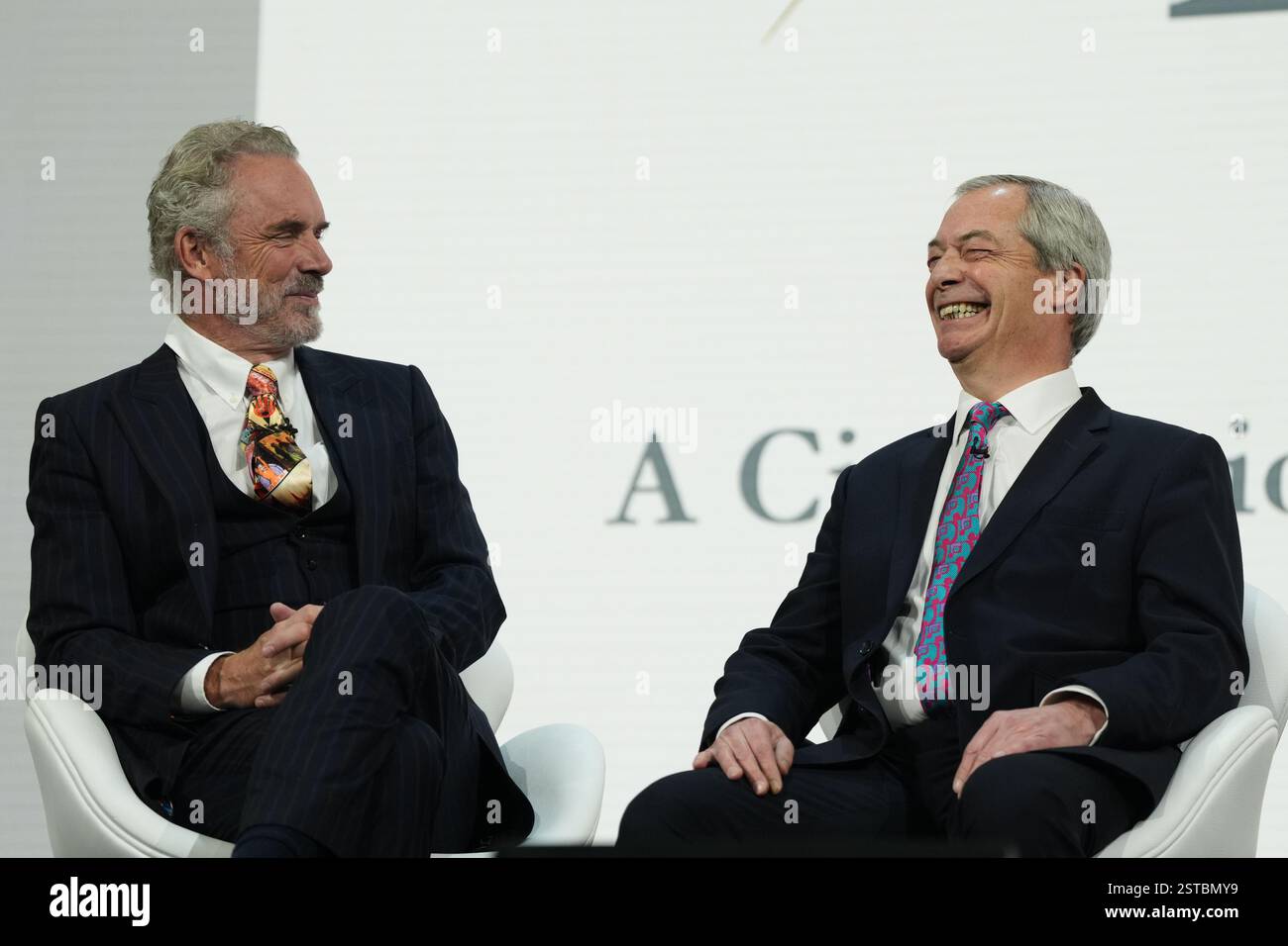 Reform UK leader Nigel Farage (right) is interviewed by Jordan Peterson ...