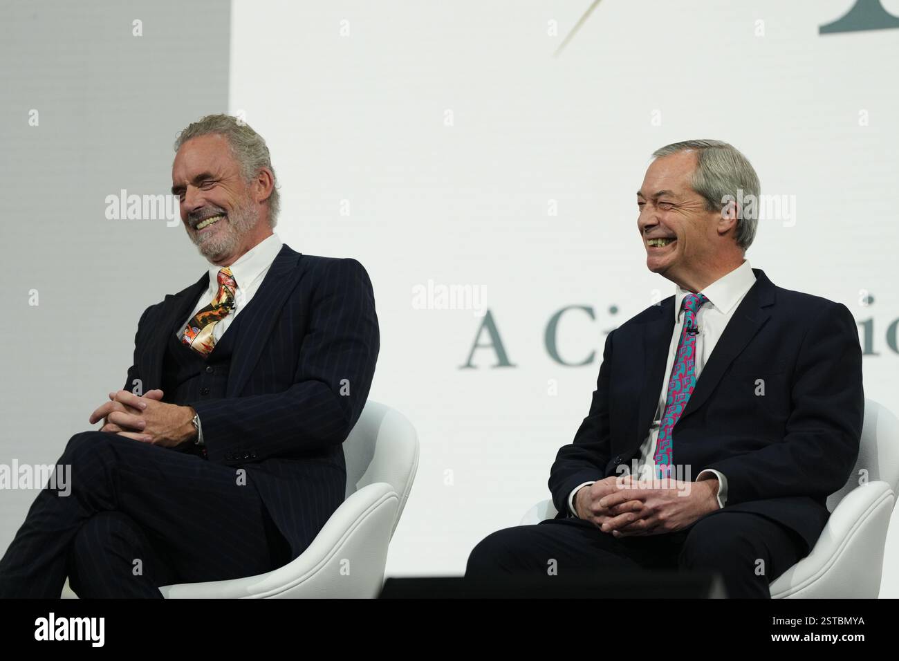 Reform UK leader Nigel Farage (right) is interviewed by Jordan Peterson ...