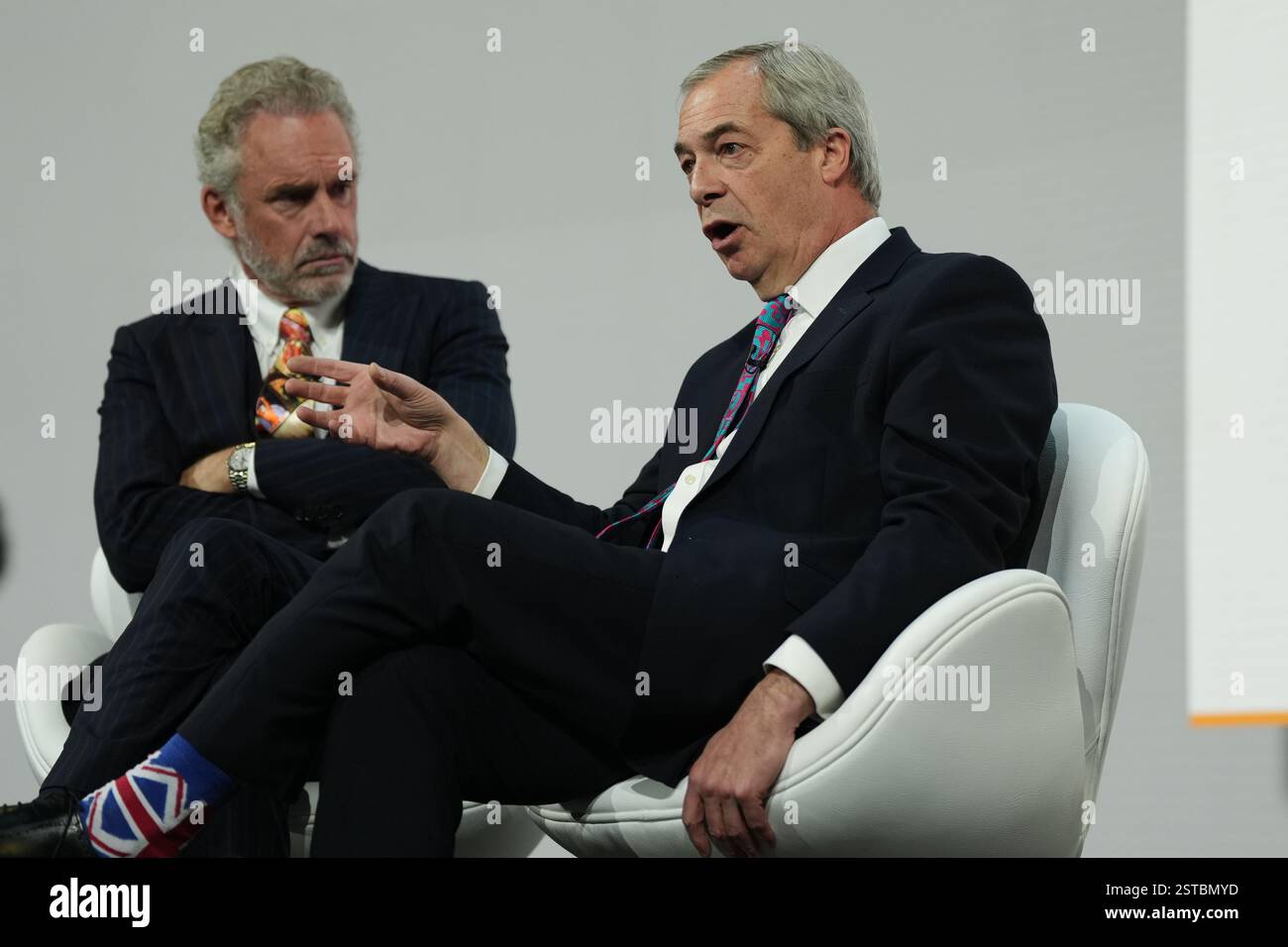 Reform UK leader Nigel Farage (right) is interviewed by Jordan Peterson ...