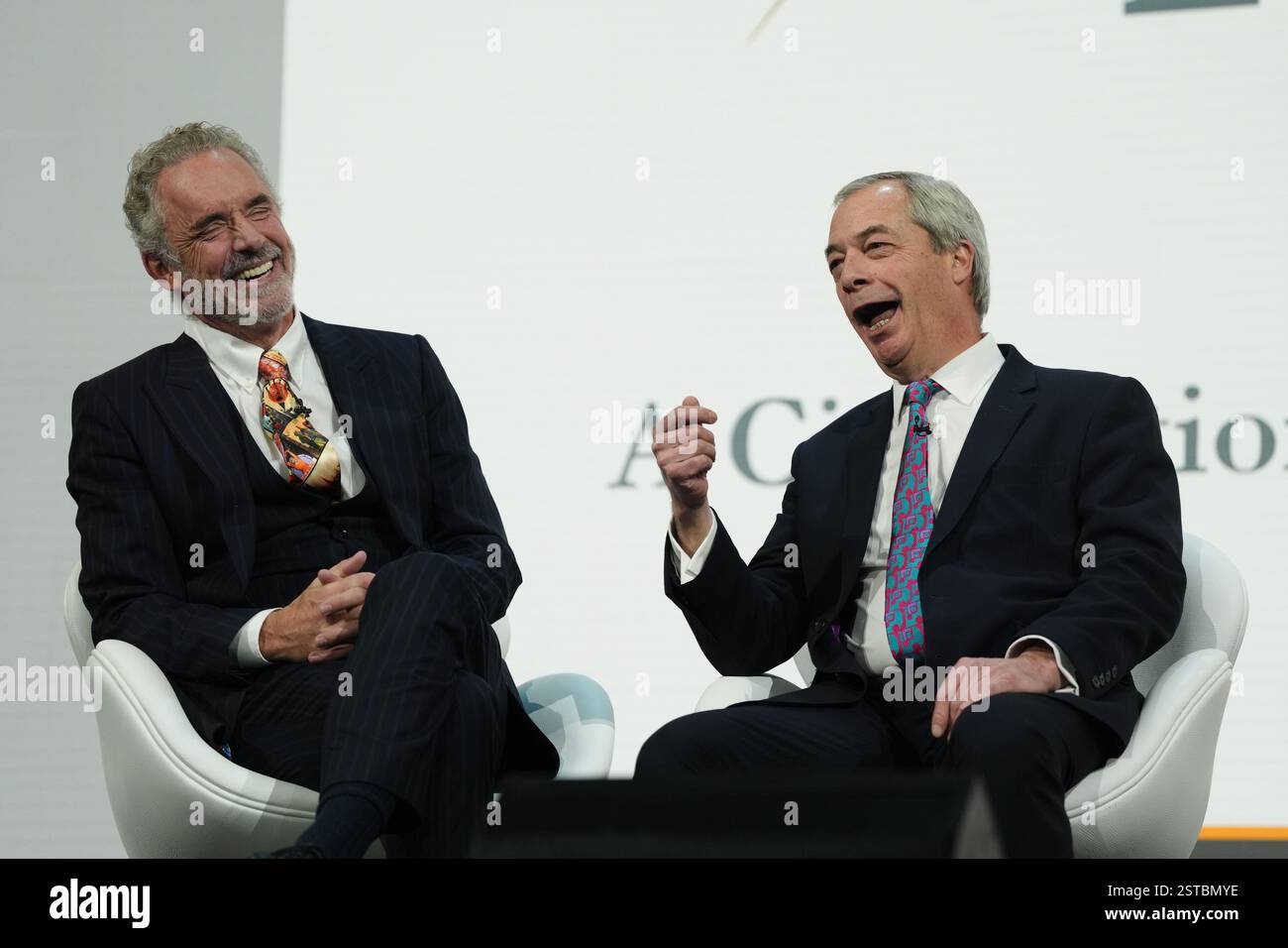Reform UK leader Nigel Farage (right) is interviewed by Jordan Peterson ...