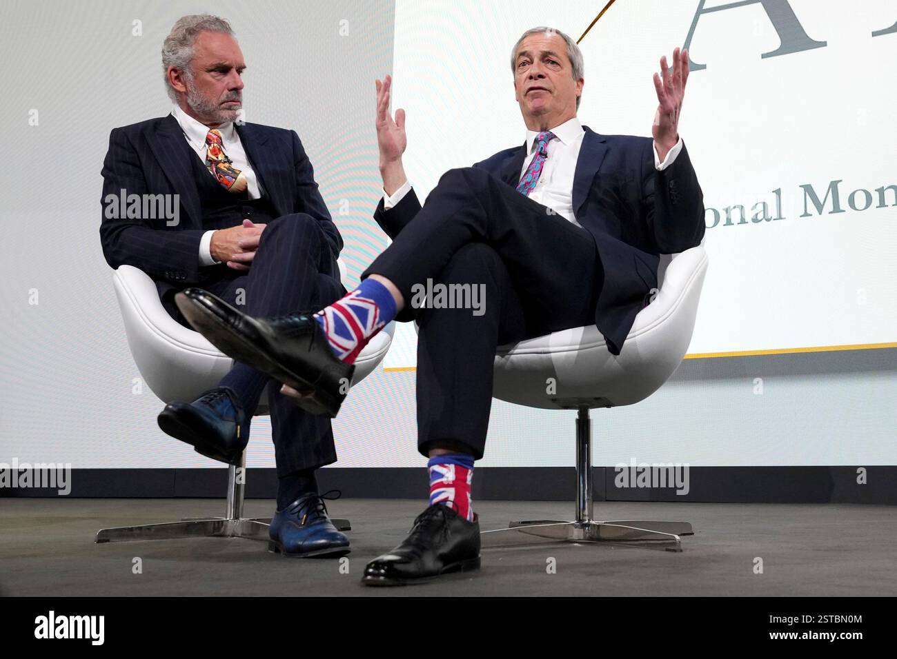 Nigel Farage, Leader of Reform UK, right, as he is interviewed on stage ...