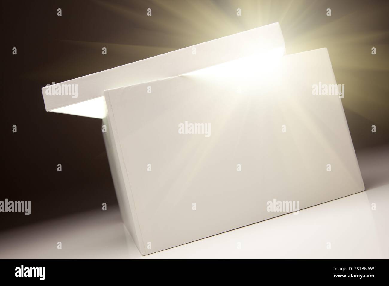 White Box with Lid Revealing Something Very Bright Stock Photo - Alamy
