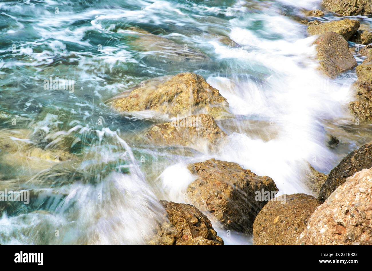 The rock on seashore with water coming wave long exposure hi-res stock ...