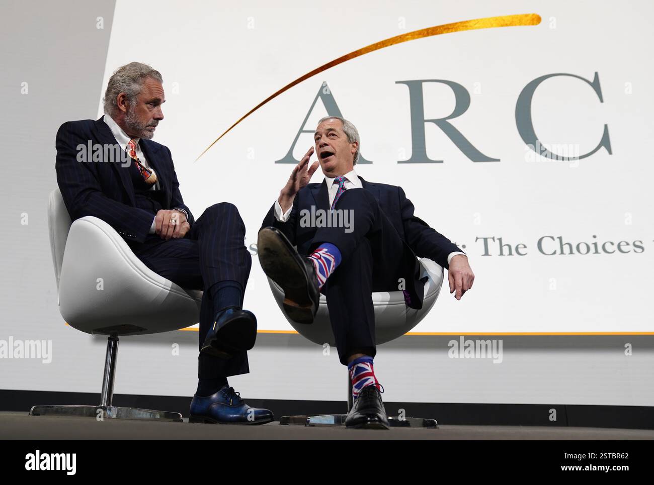 Reform UK leader Nigel Farage (right) is interviewed by Jordan Peterson ...