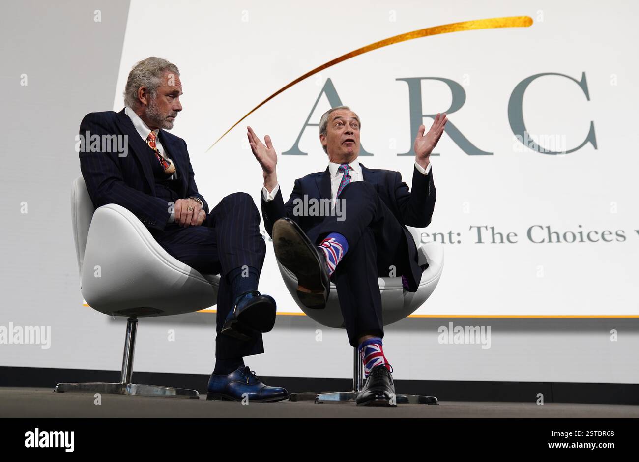 Reform UK leader Nigel Farage (right) is interviewed by Jordan Peterson ...