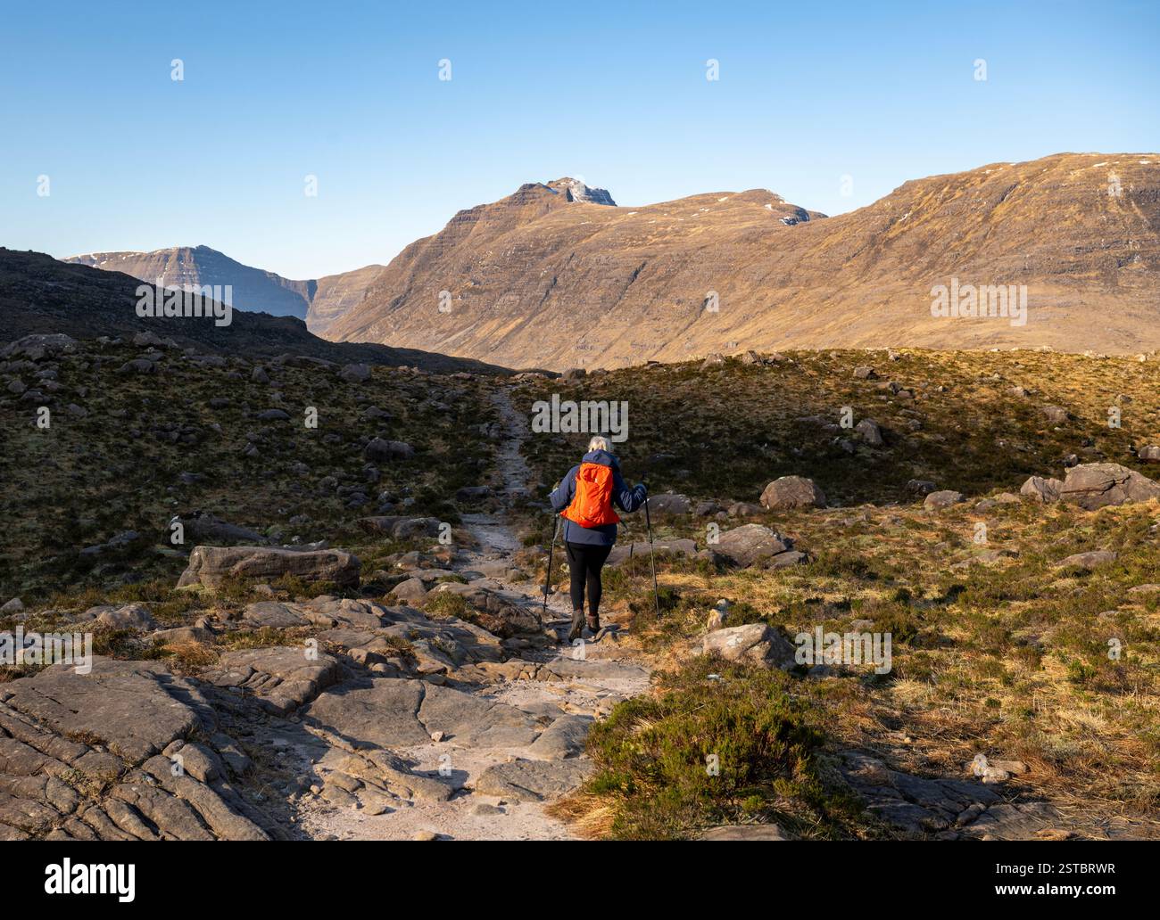 Female climber hiking Liathach and Beinn Eighe in Torridon, Scotland ...