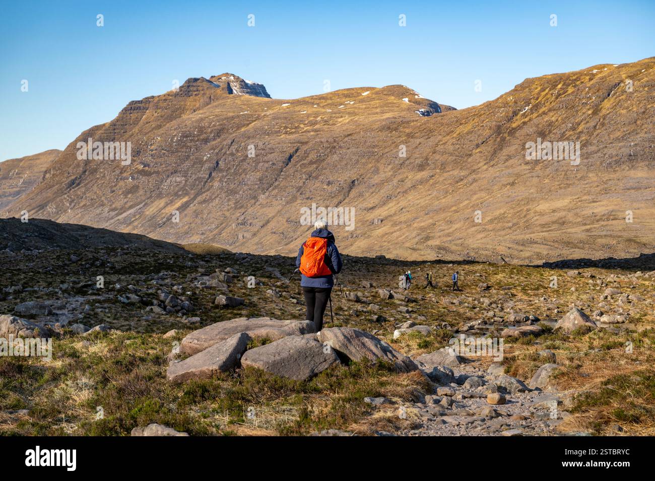 Female climber hiking Liathach and Beinn Eighe in Torridon, Scotland ...