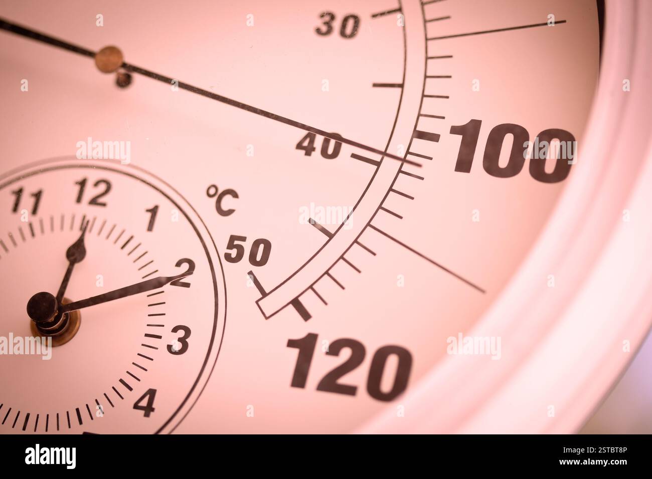 Colorized Round Thermometer Showing Over 100 Degrees Stock Photo - Alamy