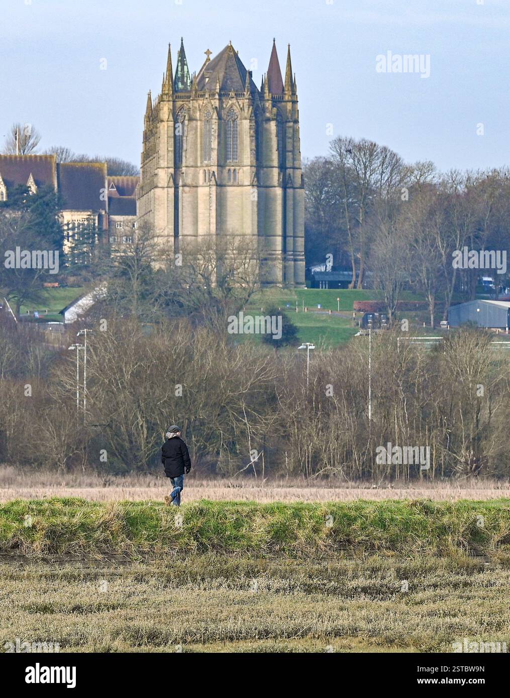Brighton UK 18th February 2025 - A walker passes by Lancing College ...
