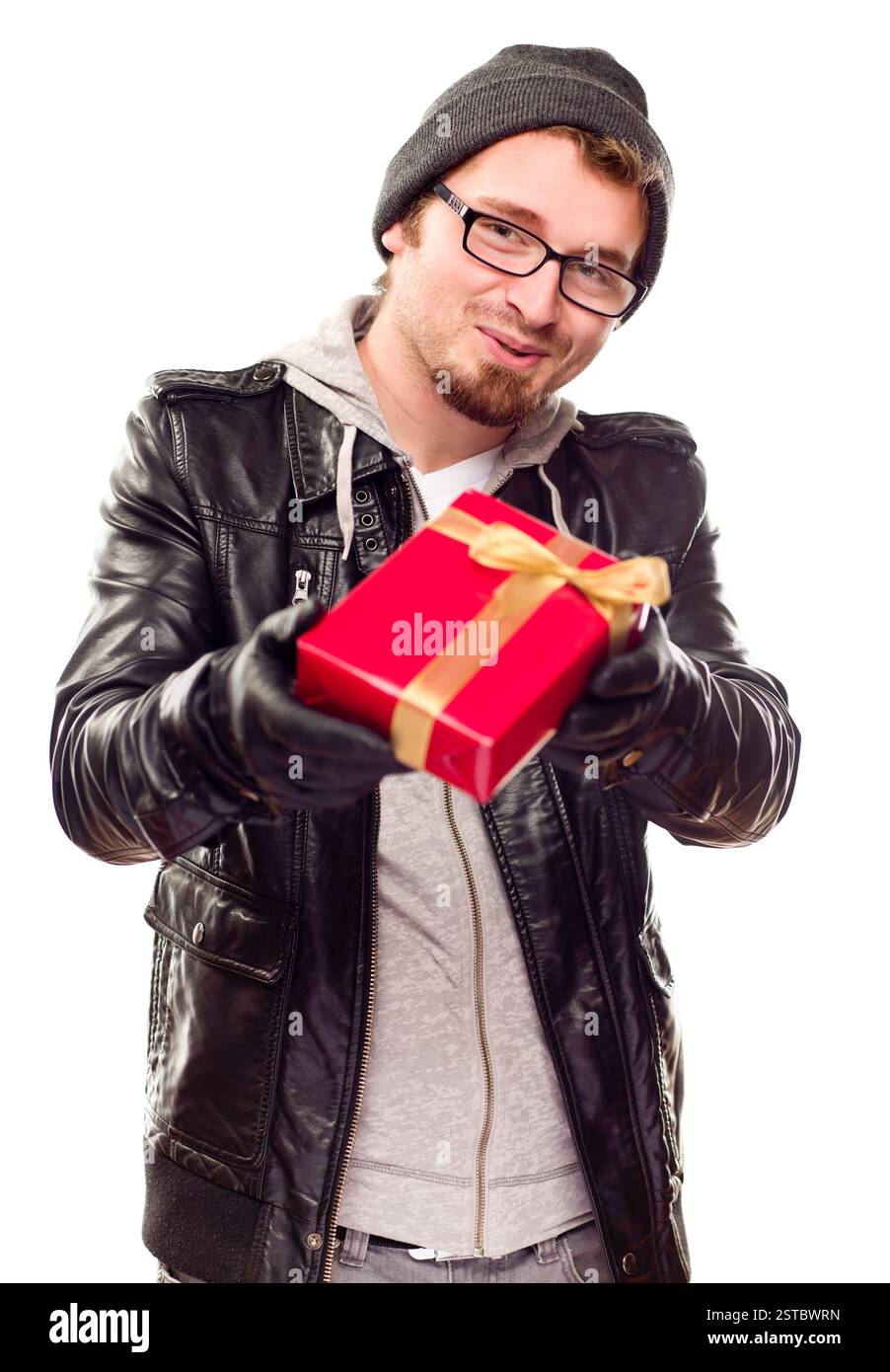 Warmly Dressed Young Man Handing Wrapped Gift Out Stock Photo - Alamy