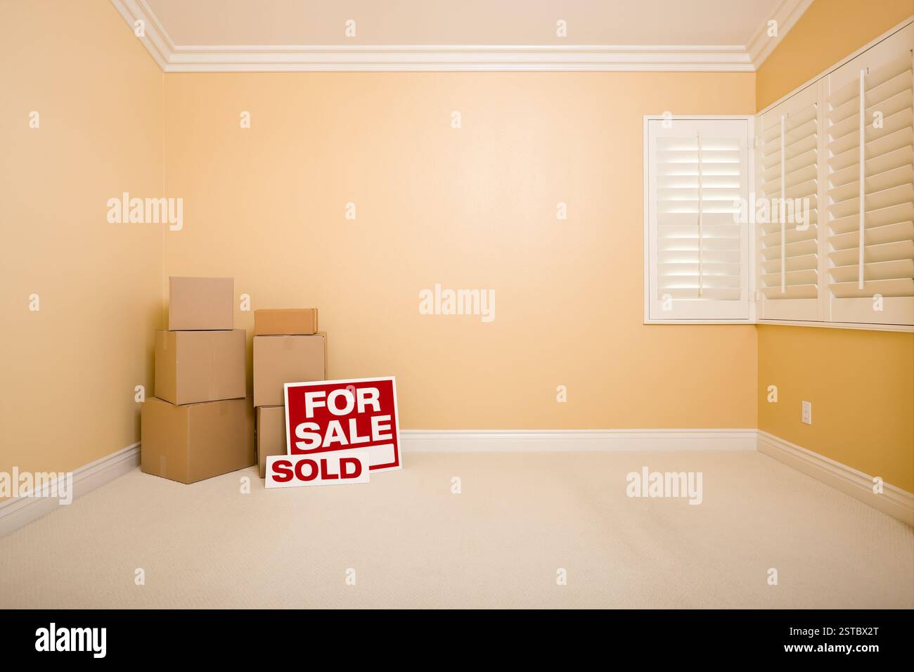Boxes, Sale and Sold Real Estate Signs in Empty Room Stock Photo - Alamy