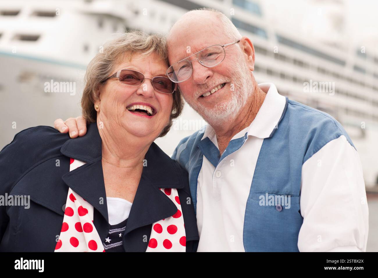 Senior Couple On Shore in Front of Cruise Ship Stock Photo - Alamy