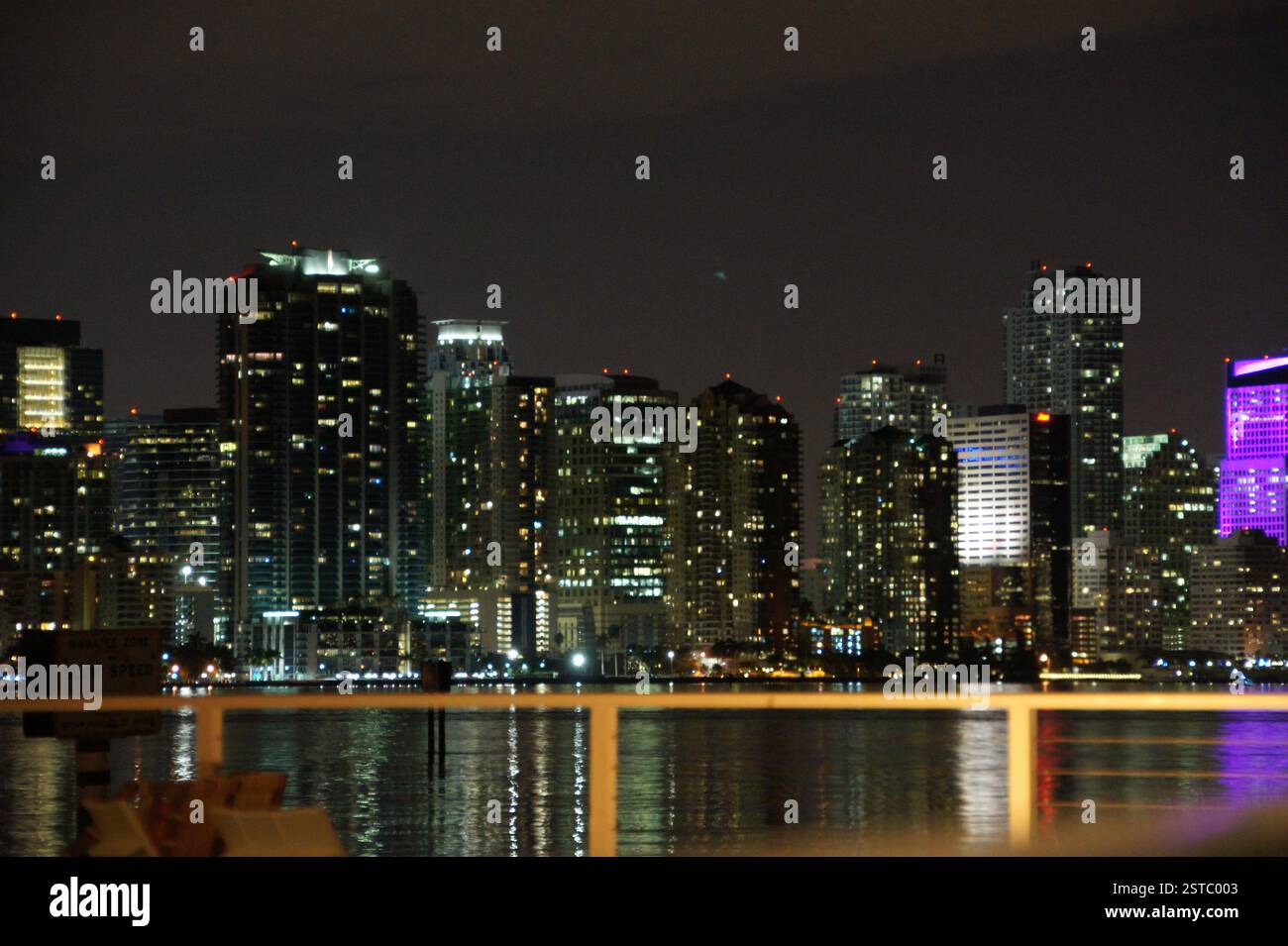 Miami skyline at night. Skyscrapers illuminated in vibrant colors ...
