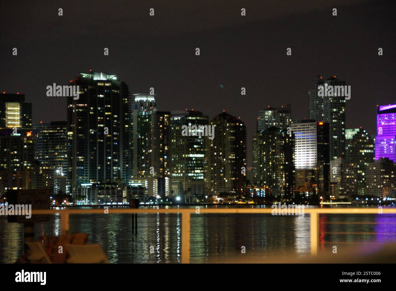 Miami skyline at night. Tall buildings illuminated with colorful lights ...