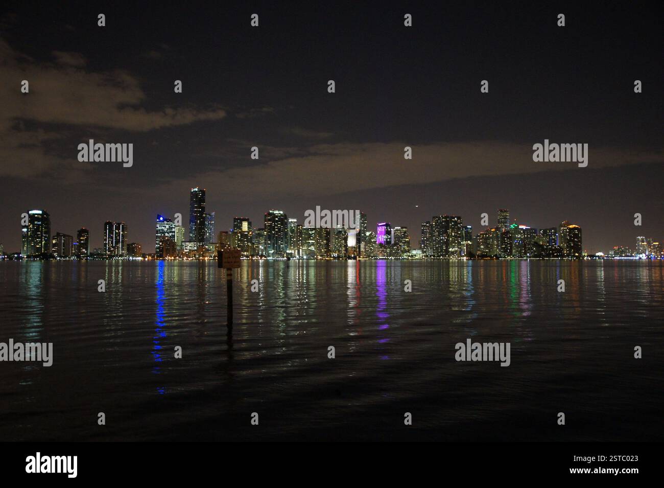 Miami skyline at night. Illuminated skyscrapers with colorful lights ...