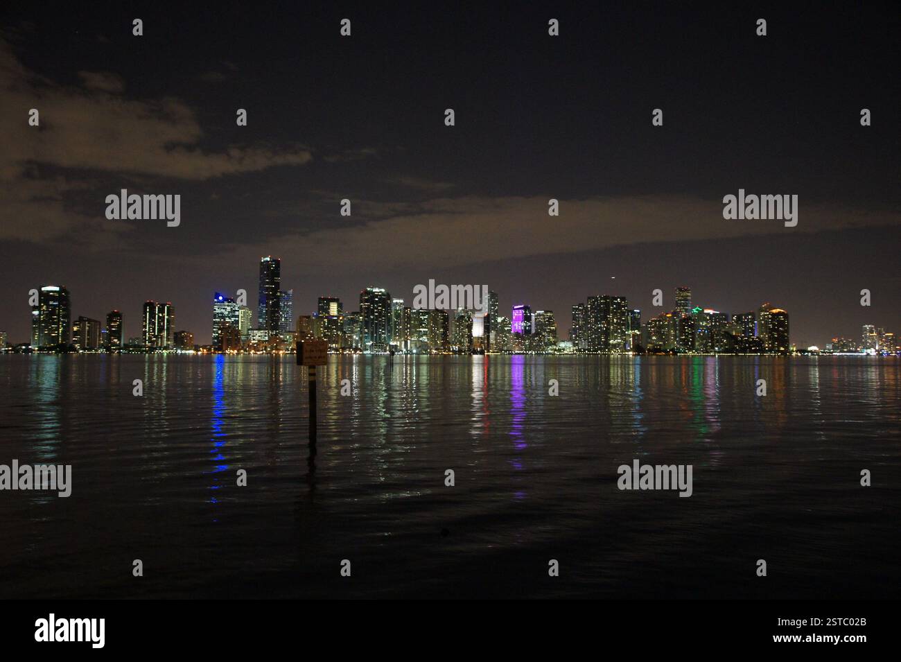 Miami skyline at night. Illuminated skyscrapers with colorful lights ...