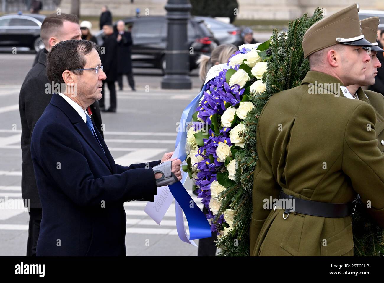 Israeli President Isaac Herzog lays a wreath at the Memorial Stone of ...